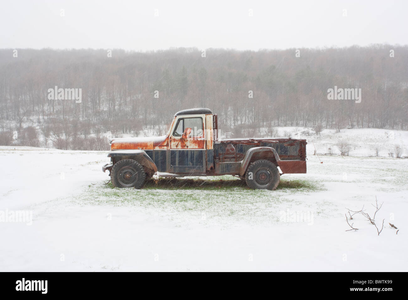 Old rusted truck parked in snow Stock Photo - Alamy