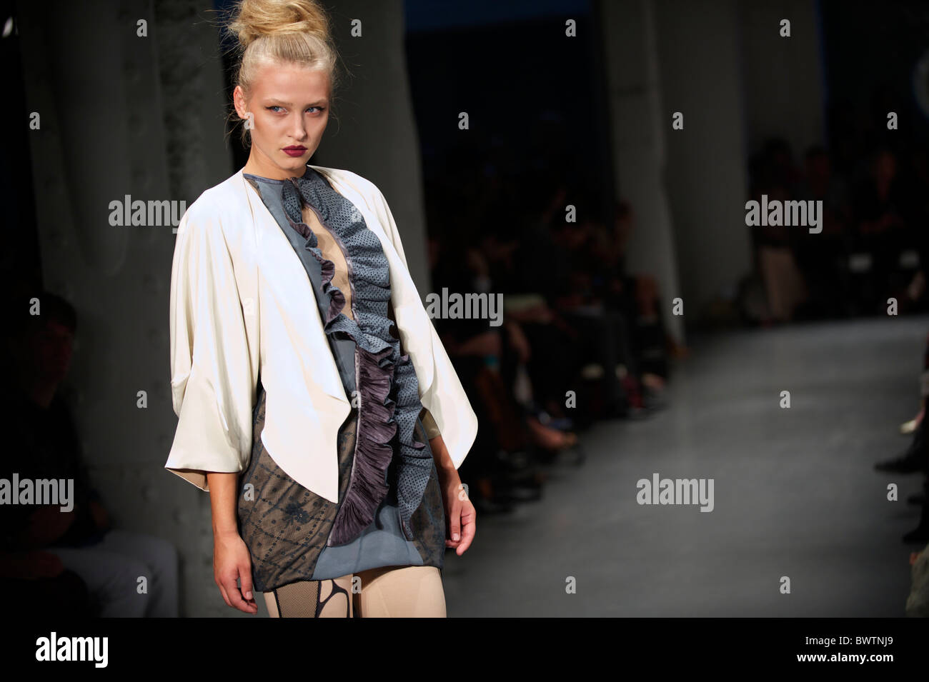 Models exhibit the Bora Aksu spring 2011 collection down the catwalk at ...