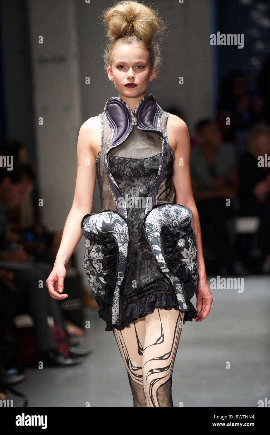 Models exhibit the Bora Aksu spring 2011 collection down the catwalk at ...