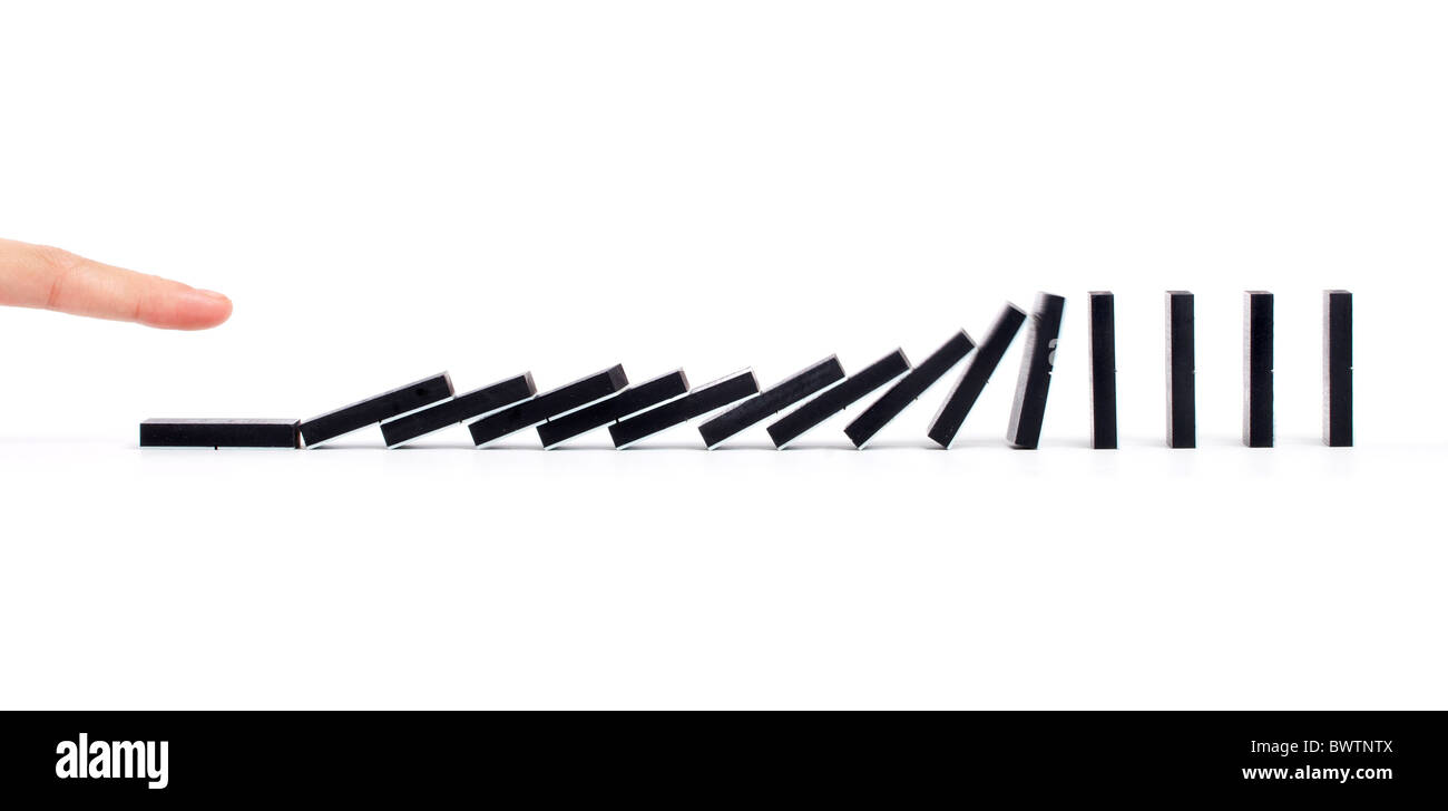 Finger pushing dominoes hi-res stock photography and images - Alamy