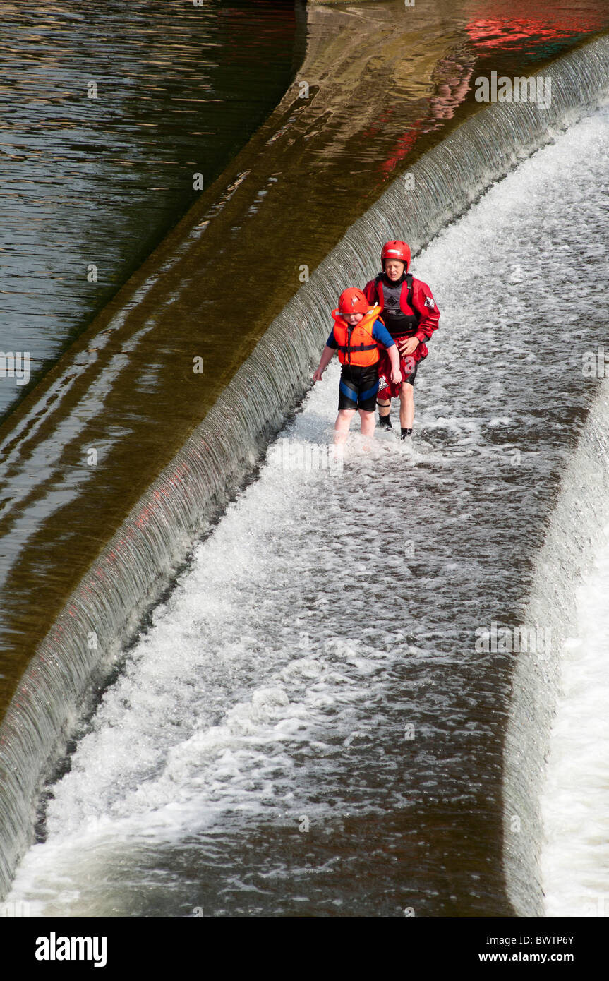 A man and young boy in the weir at the city of Bath, England Stock ...