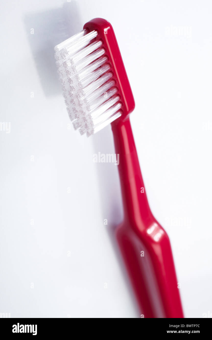 Single red toothbrush on white background close up portrait Stock Photo ...
