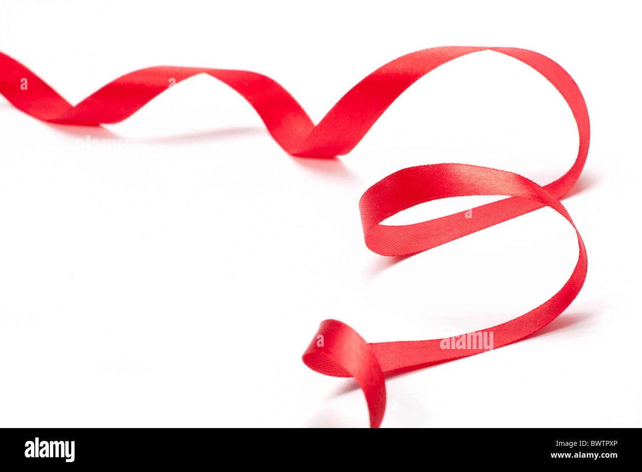 Red ribbon on white background Stock Photo - Alamy