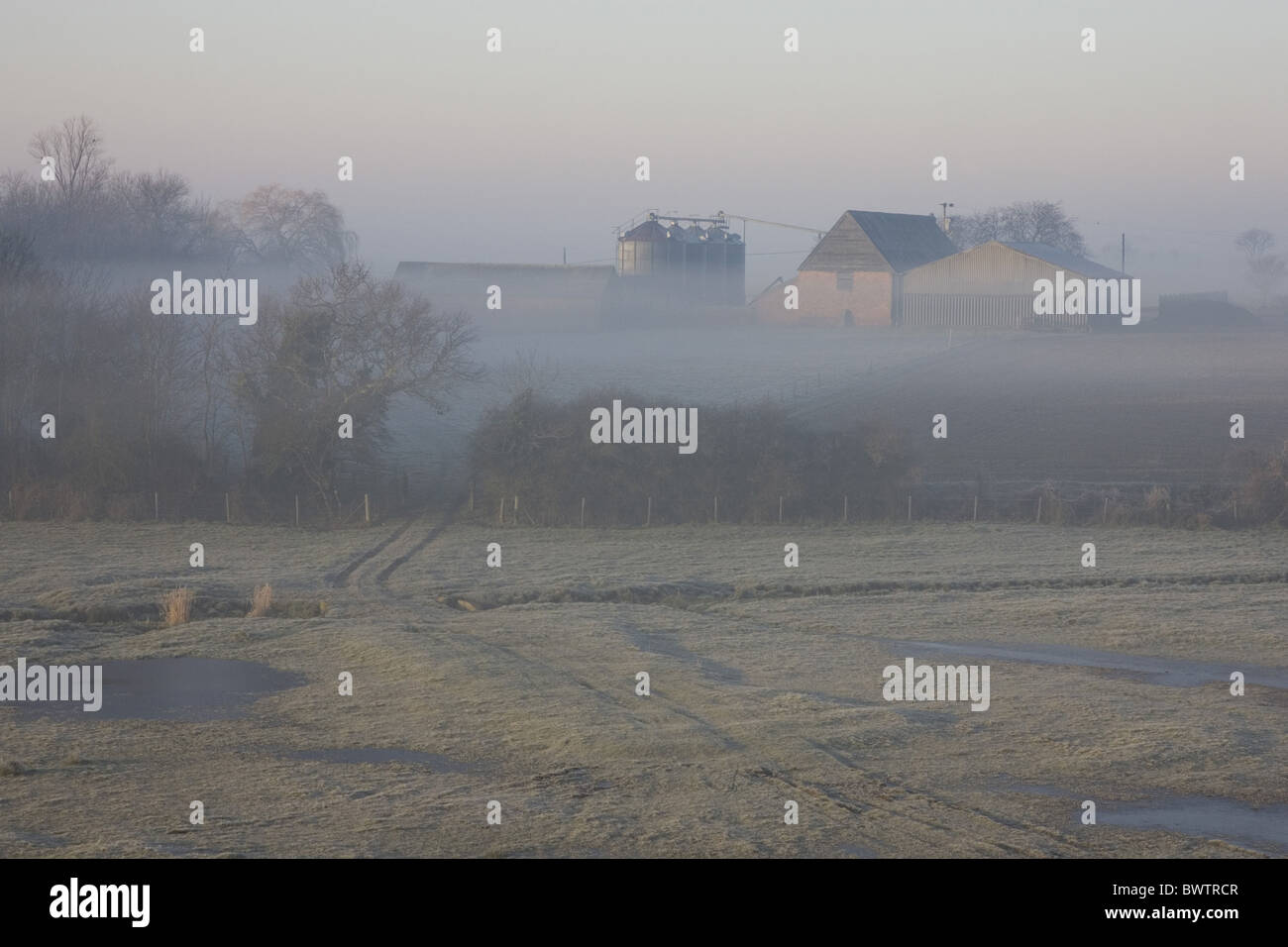 Early morning mist frost over farmland farm Stock Photo - Alamy
