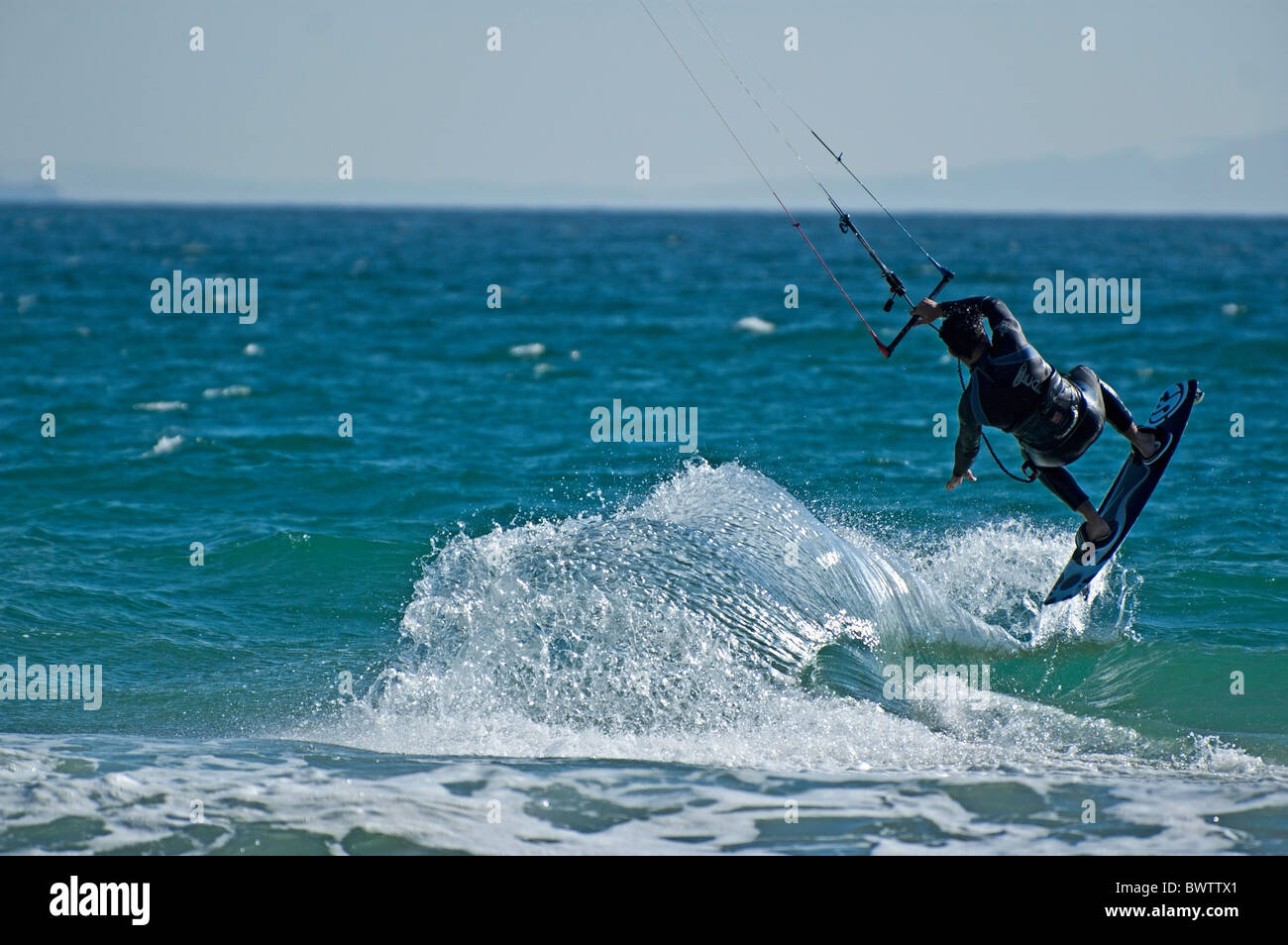 Surfer kitesurfing jumping air hi-res stock photography and images - Alamy