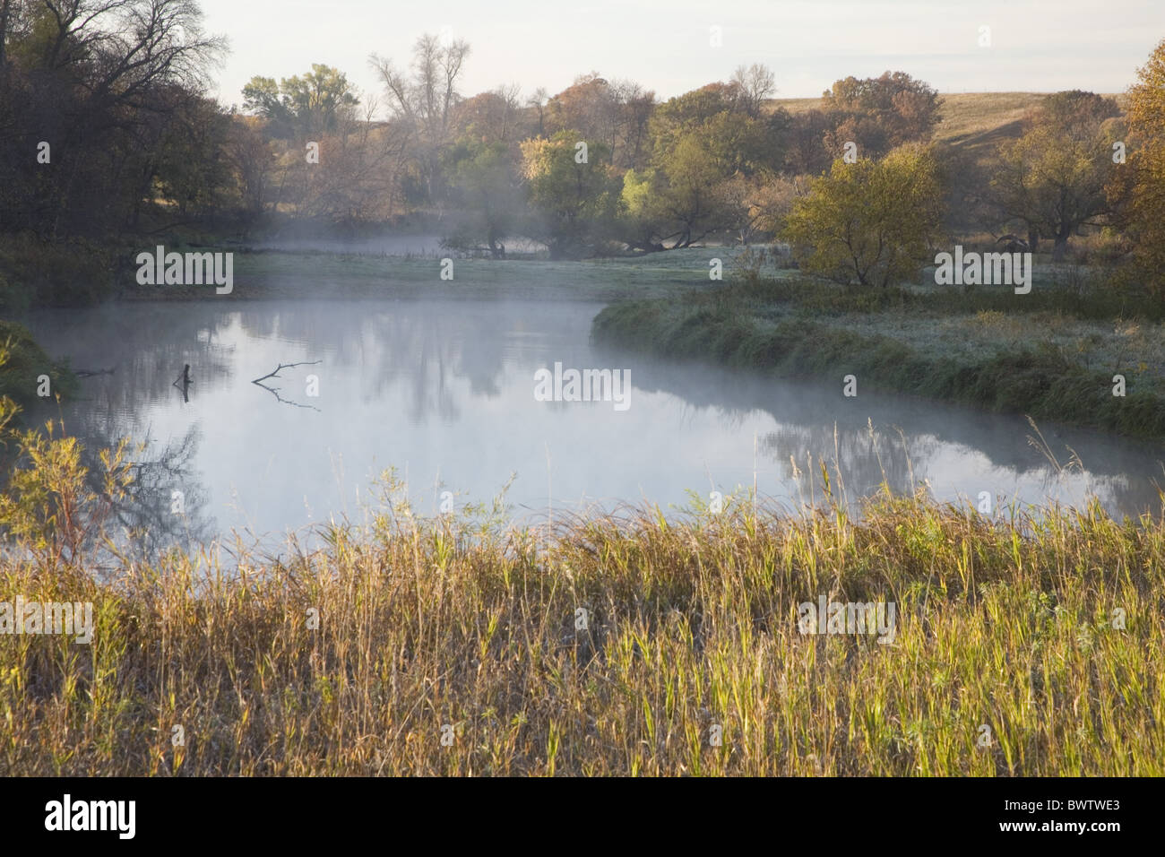 Mist rising from water during cold morning Stock Photo - Alamy