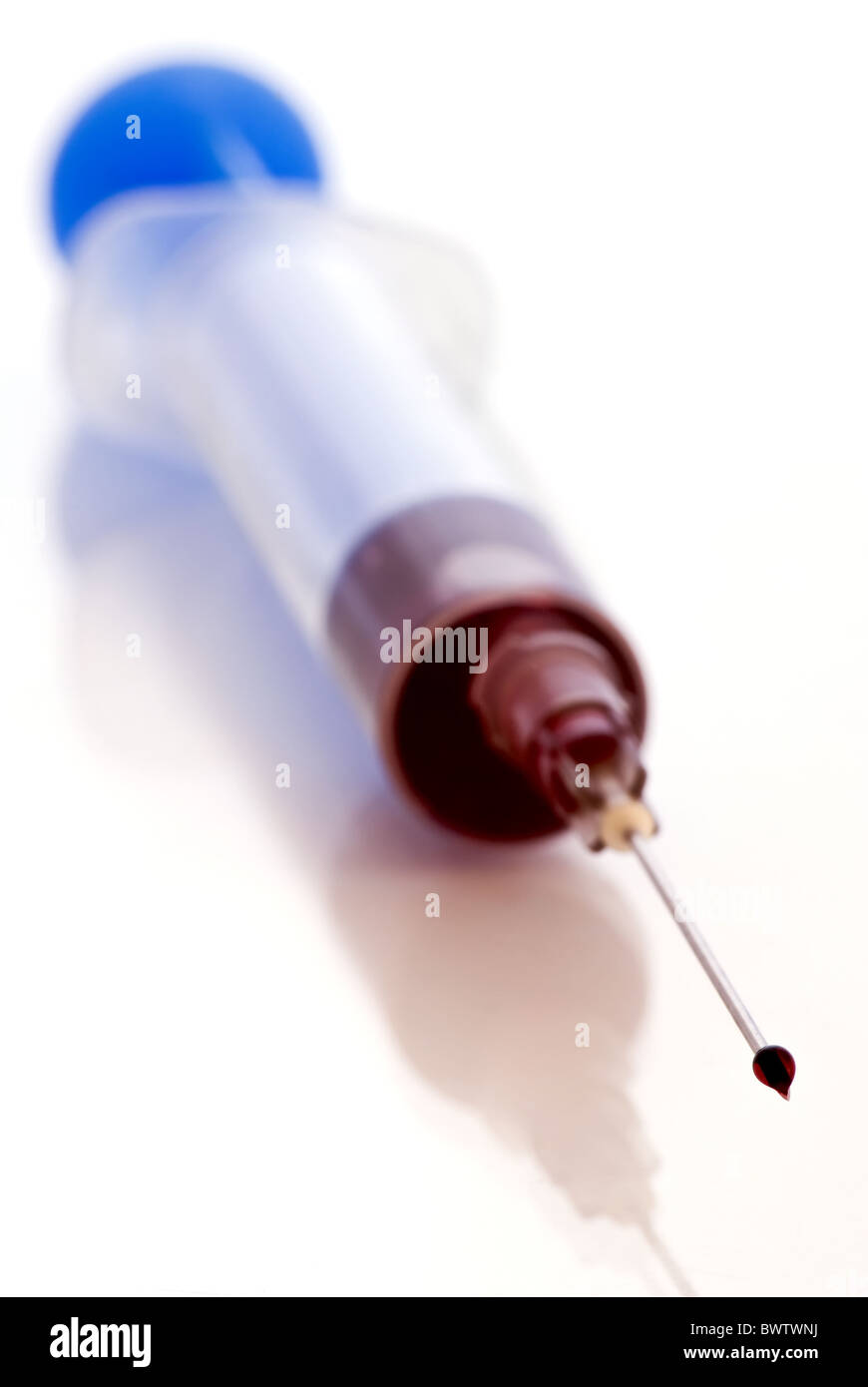 Injections with blood as closeup on white background Stock Photo - Alamy