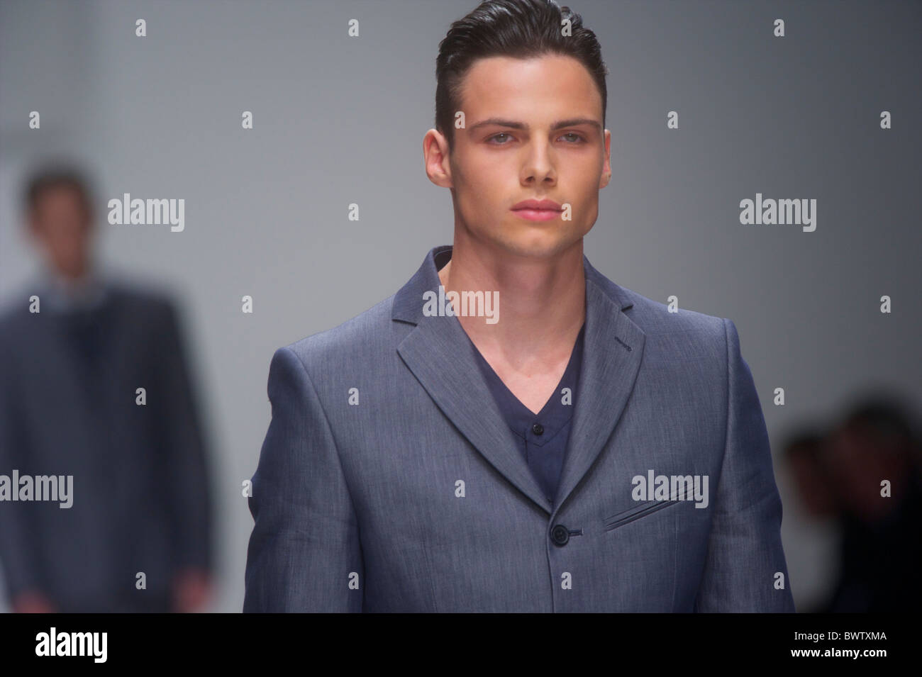 Models exhibit the Paul Costelloe spring 2011 collection down the ...