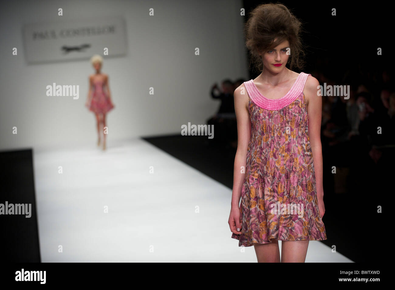 Models exhibit the Paul Costelloe spring 2011 collection down the ...