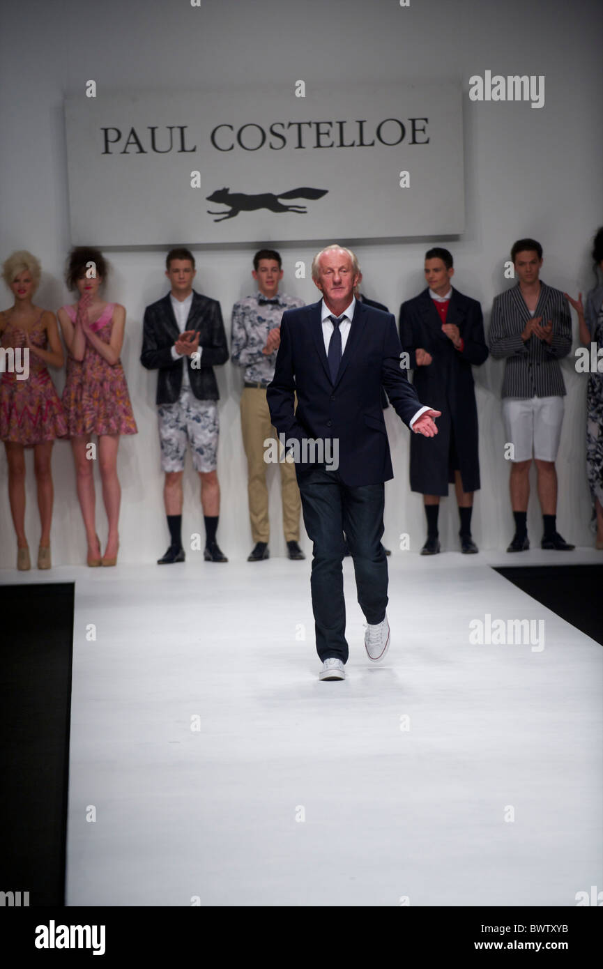 Designer Paul Costelloe takes a bow after showing his spring 2011 ...