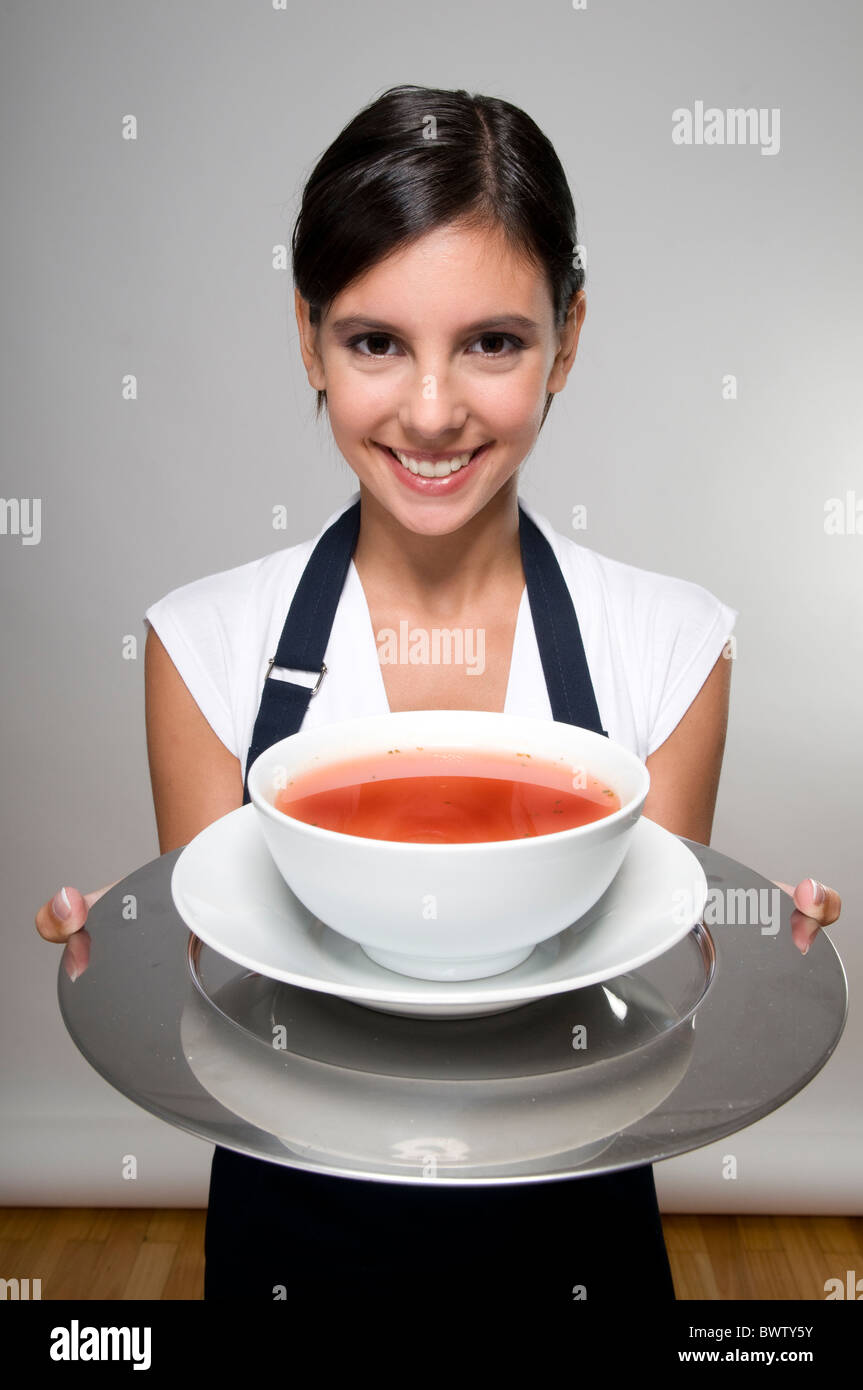 Lady carrying utensils hi-res stock photography and images - Alamy