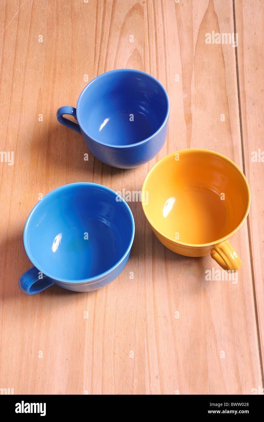 Colored bowls on table Stock Photo - Alamy