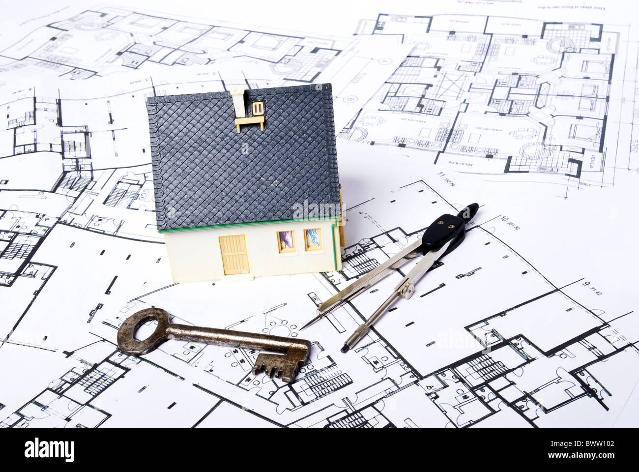 house on plans with old key Stock Photo - Alamy