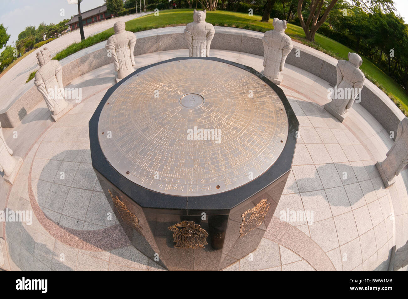 Chinese zodiac astrology statues, surrounding a calendar, outside ...