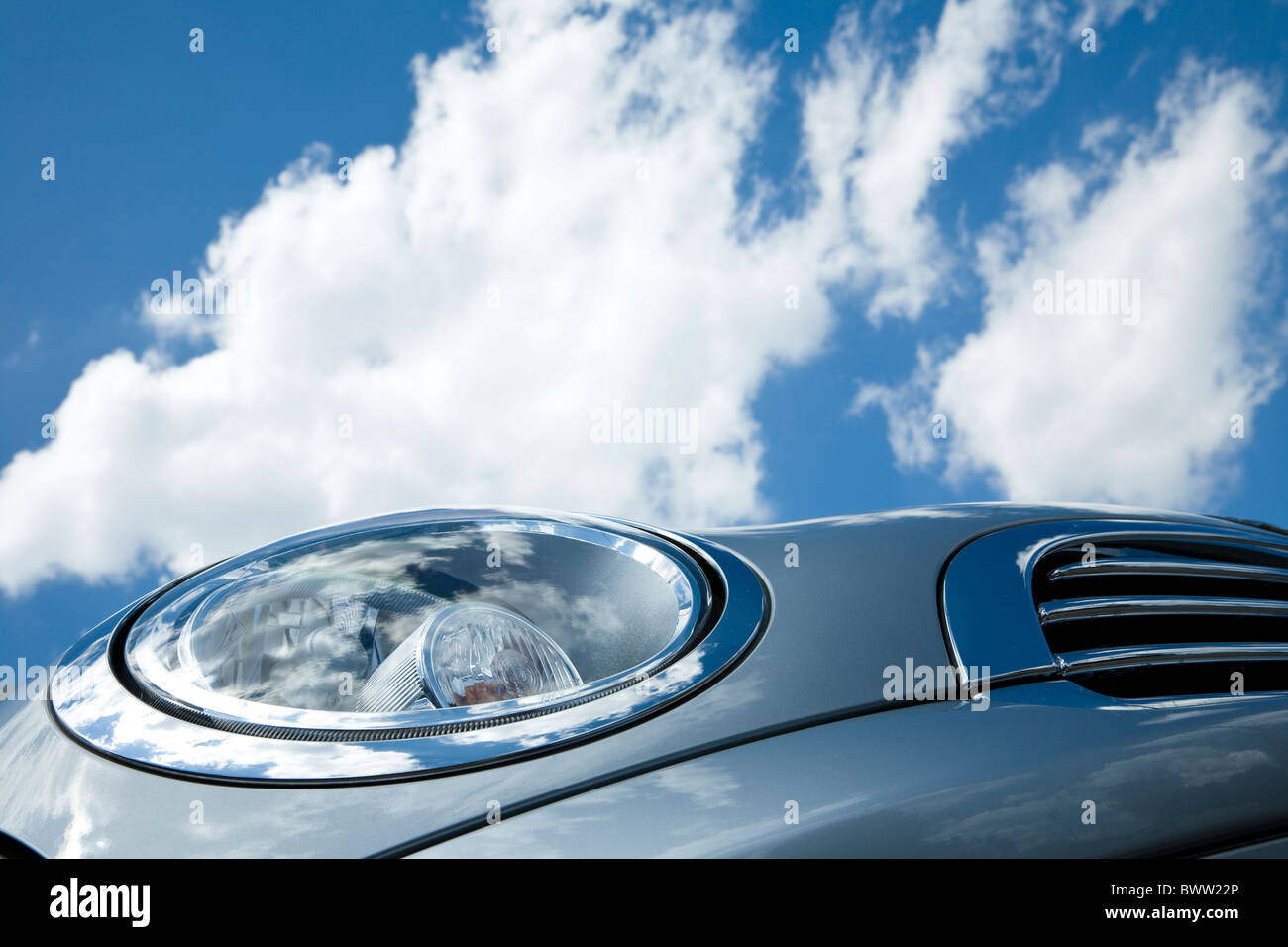 close-up front of a Mini car against blue sky, BMW Mini Cooper Stock ...