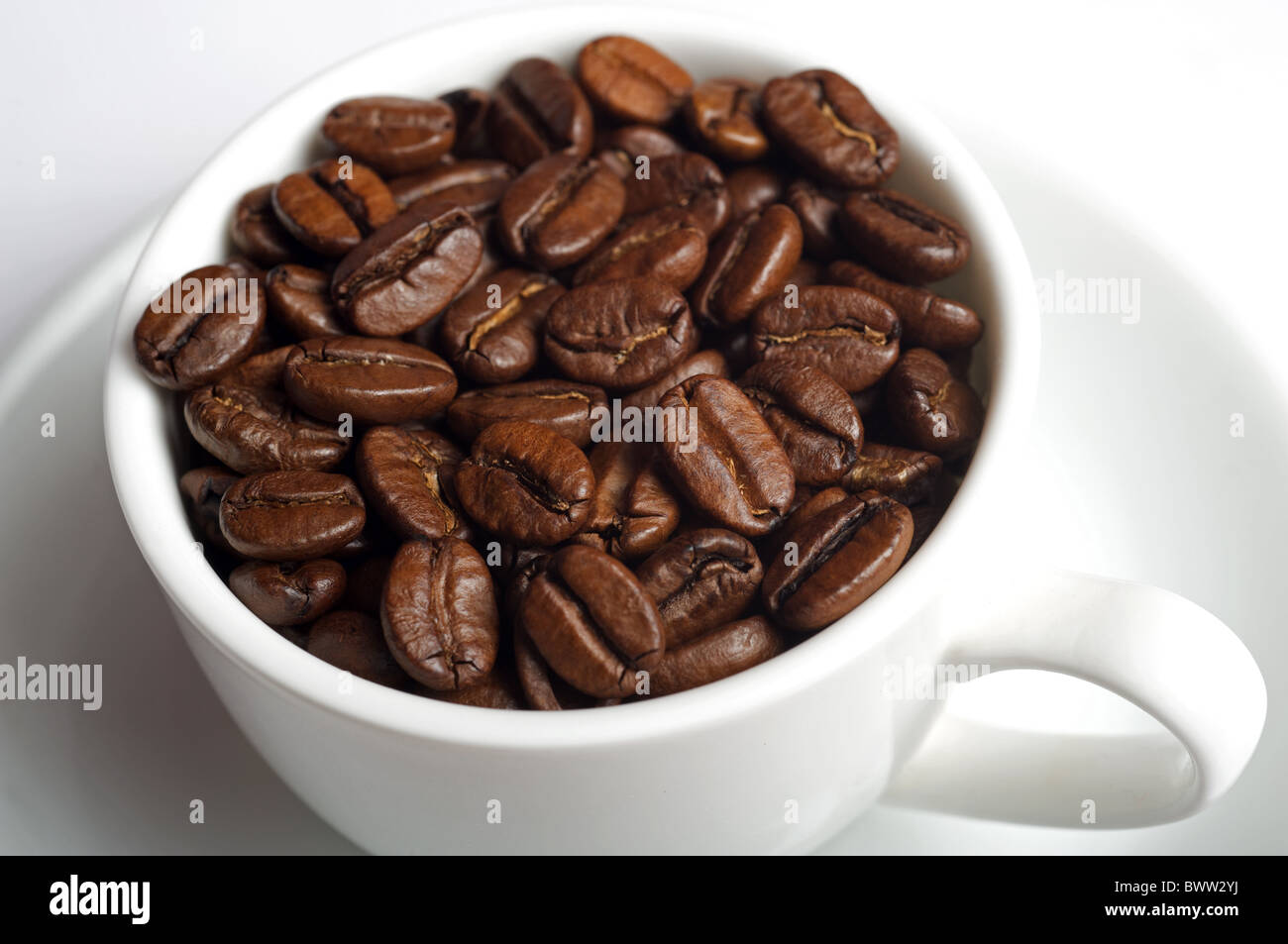 Coffee beans in cup Stock Photo - Alamy