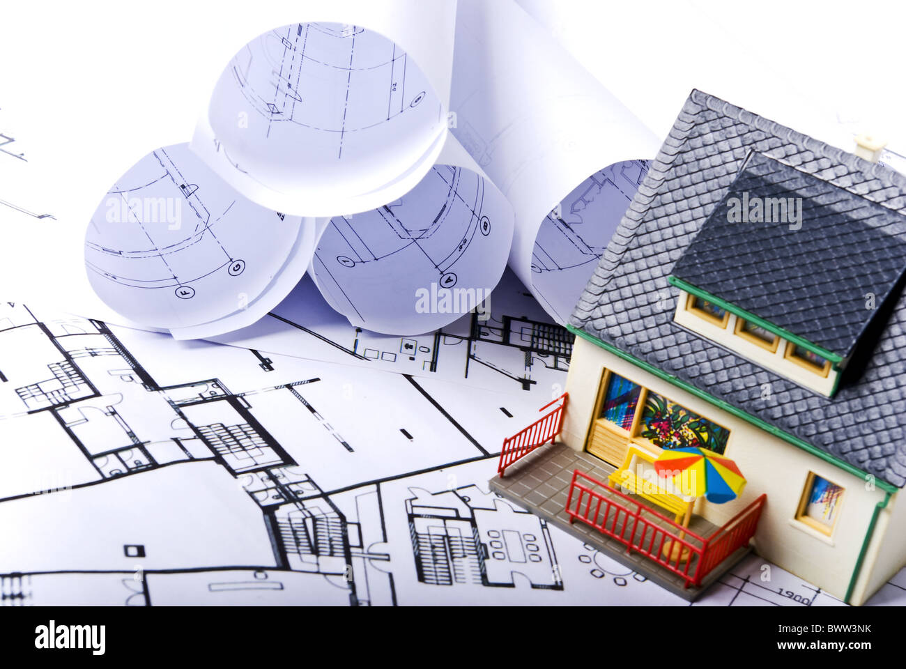 model house with some plans documents Stock Photo - Alamy