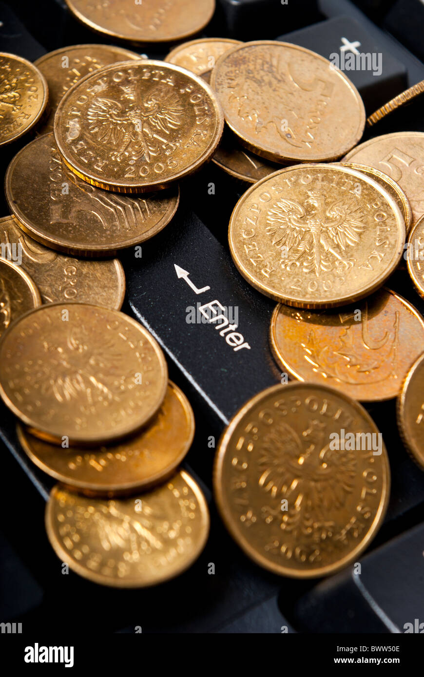 coins on enter button keyboard Stock Photo - Alamy