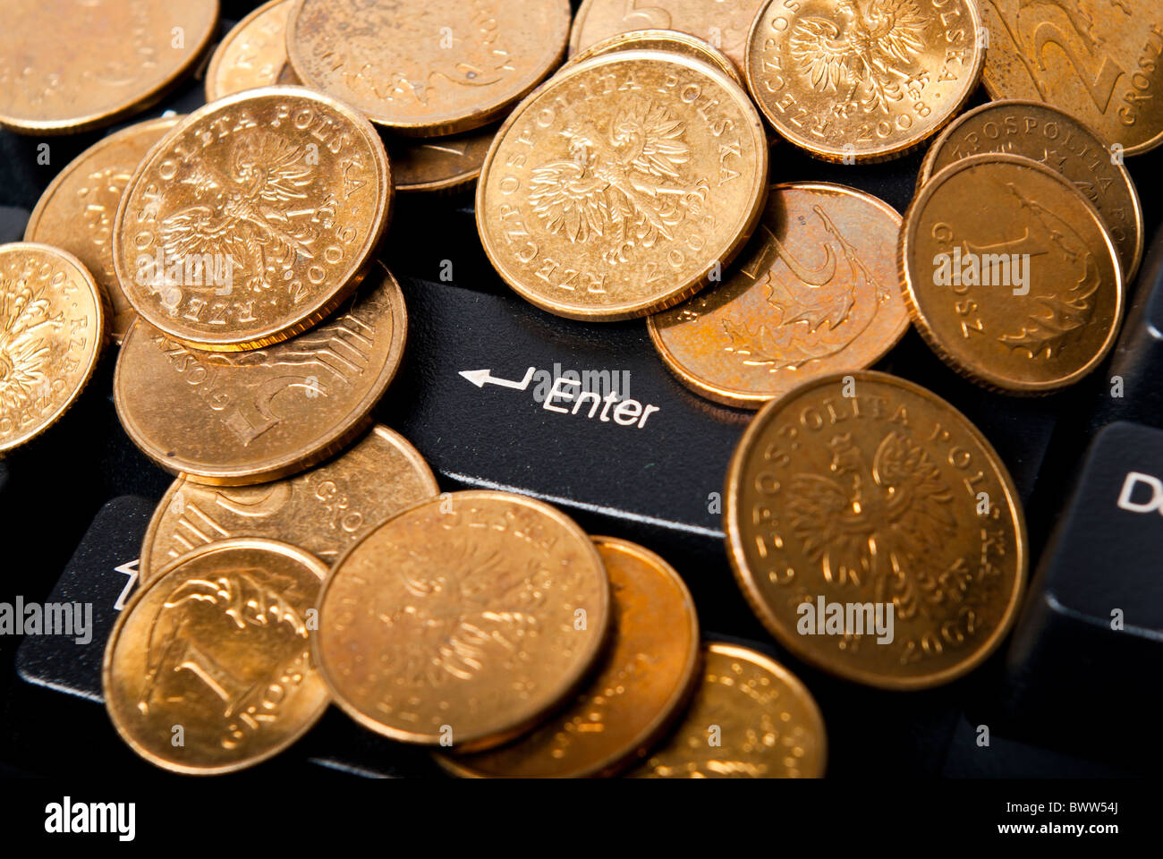 coins on enter button keyboard Stock Photo - Alamy