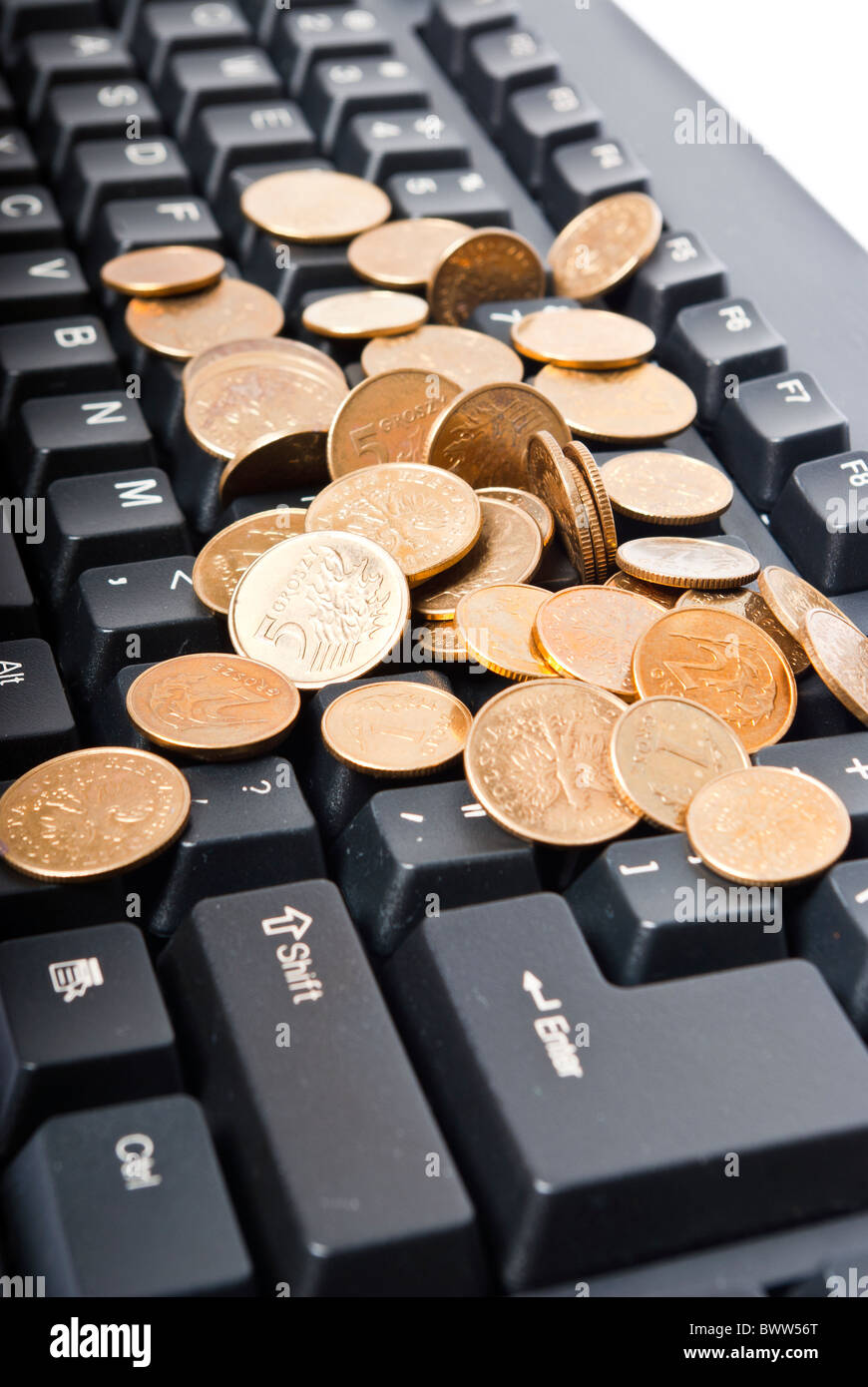 coins on enter button keyboard Stock Photo - Alamy