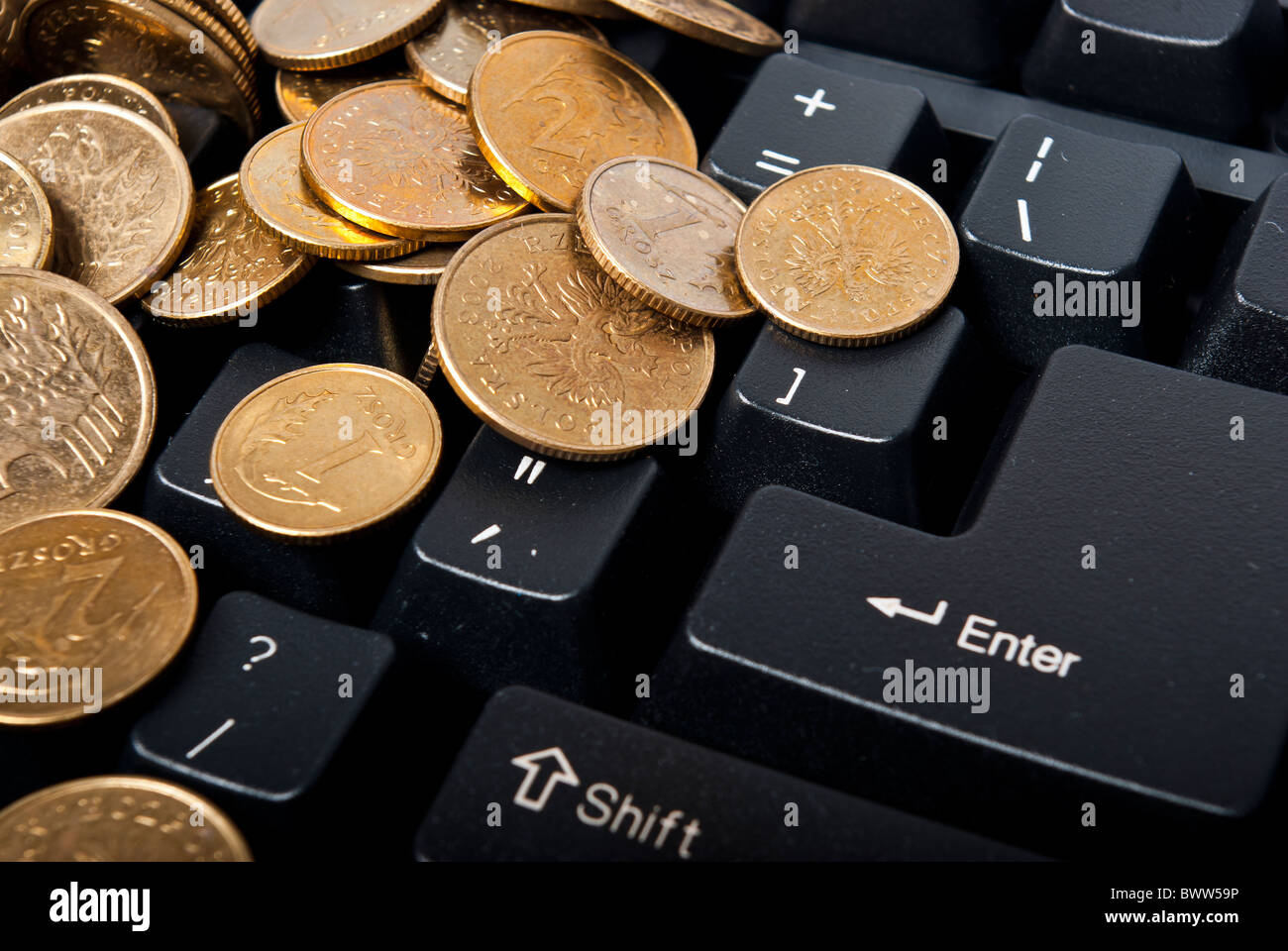 coins on enter button keyboard Stock Photo - Alamy