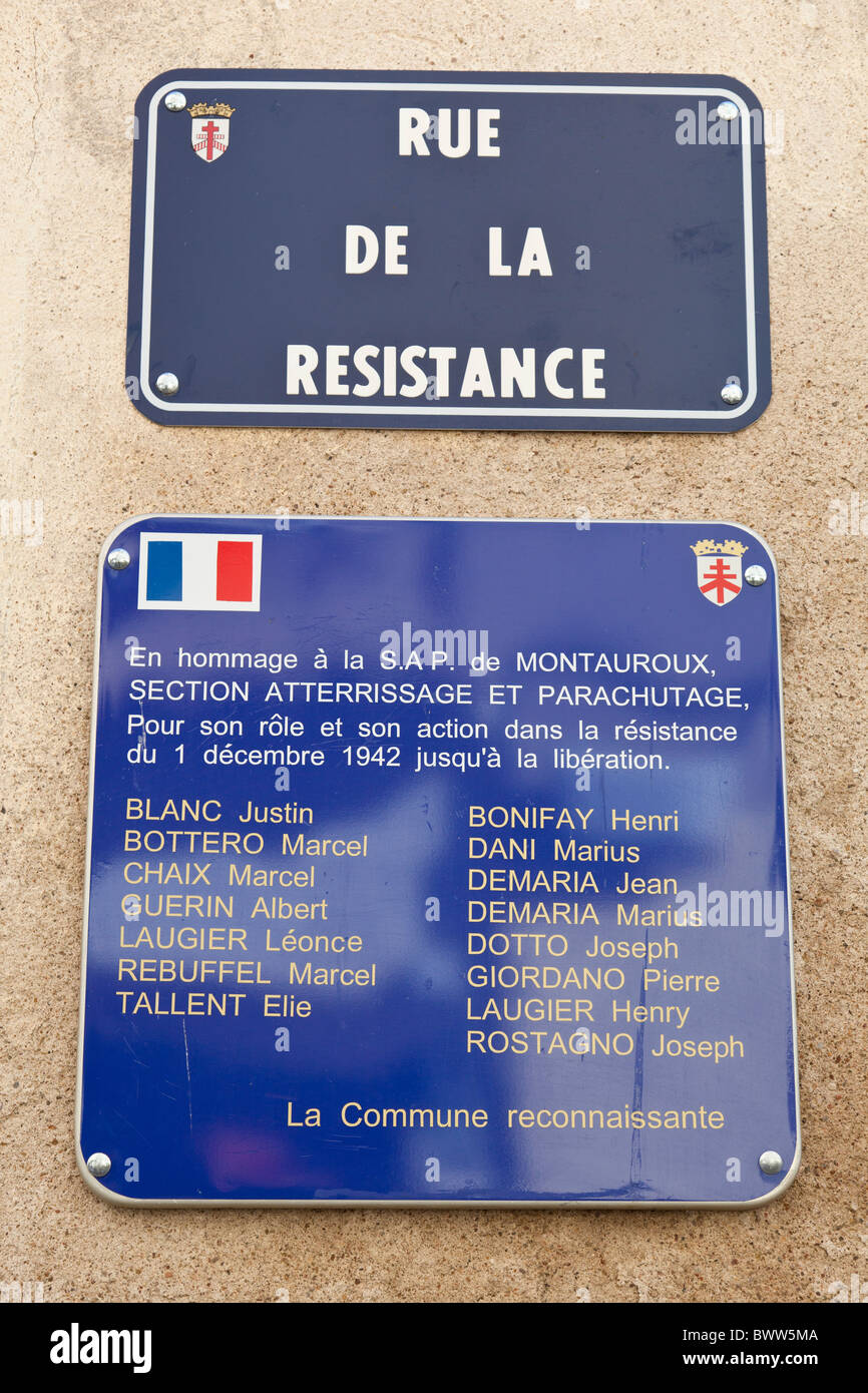 A street sign and plaque, refering to 'the resistance' during WW2 ...
