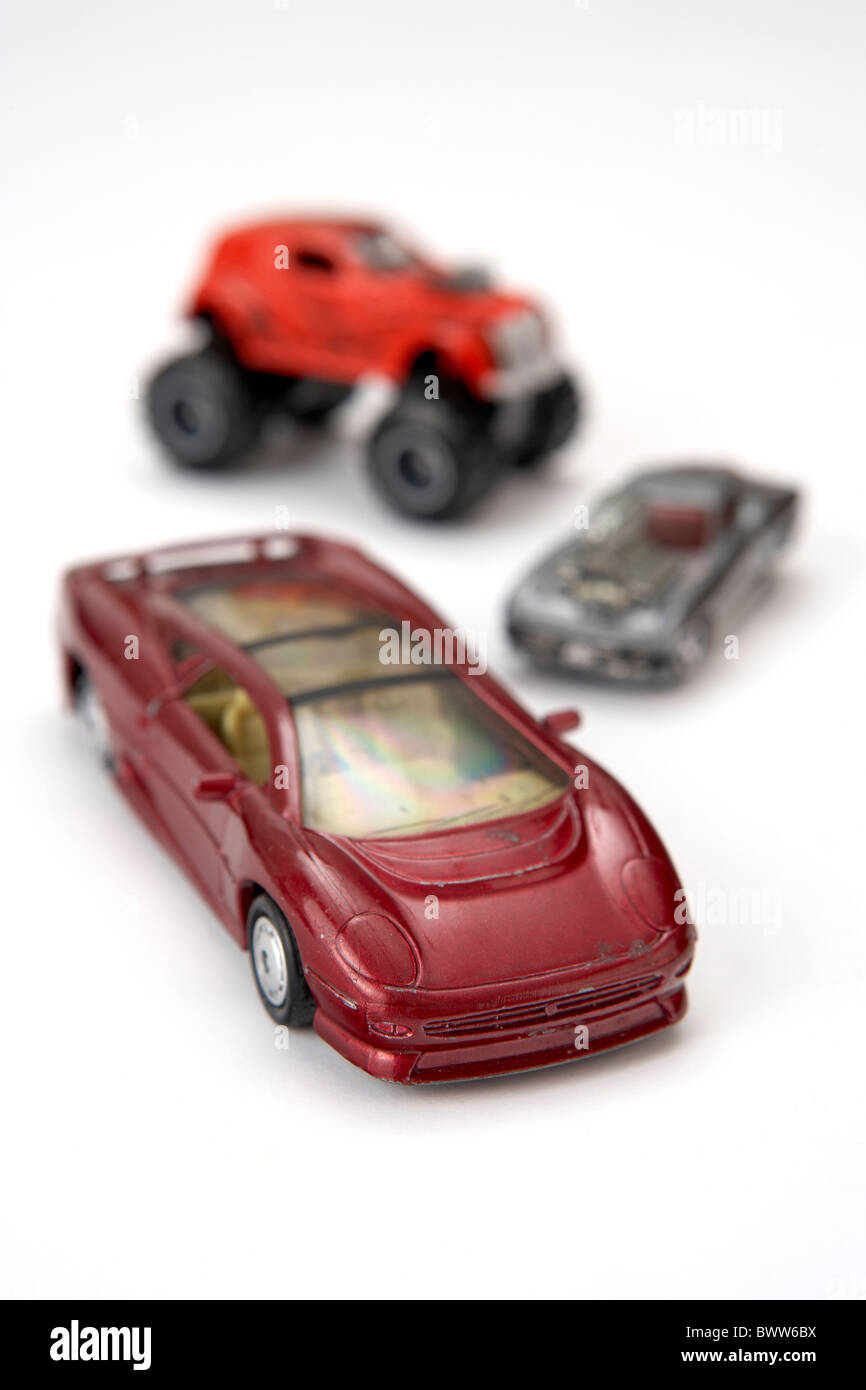 old toy cars still life on white background Stock Photo - Alamy