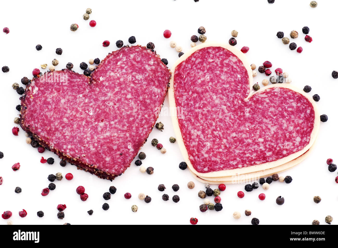 Two spicy heart samali with peppercorn as closeup on white background ...