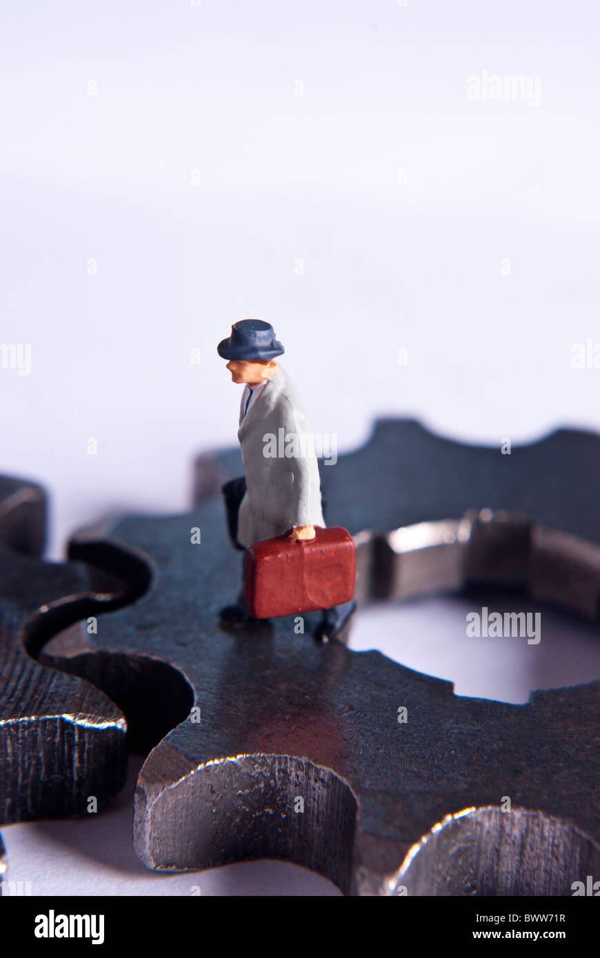 miniature man on gears Stock Photo - Alamy