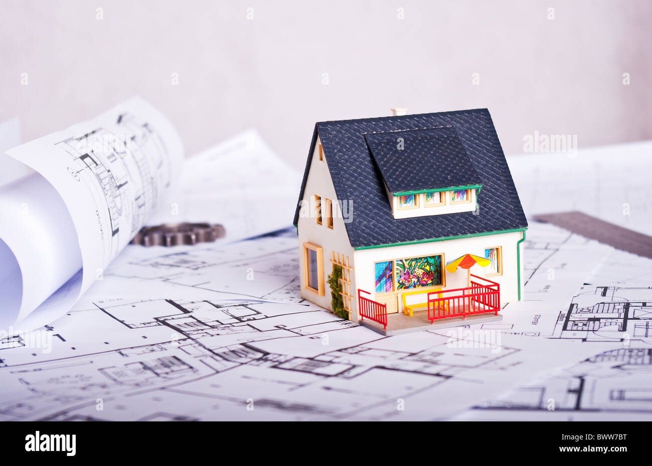 miniature house on plans document Stock Photo - Alamy