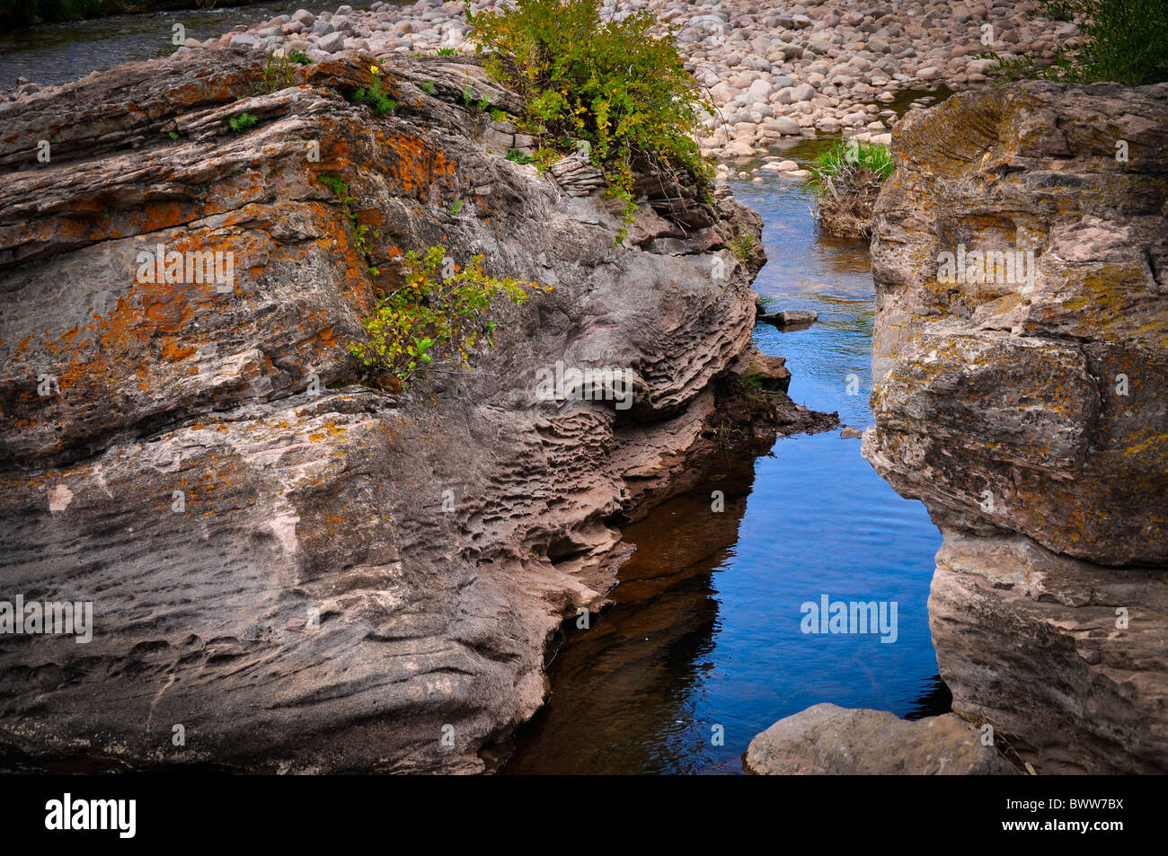 two river boulders with water running through them Stock Photo - Alamy