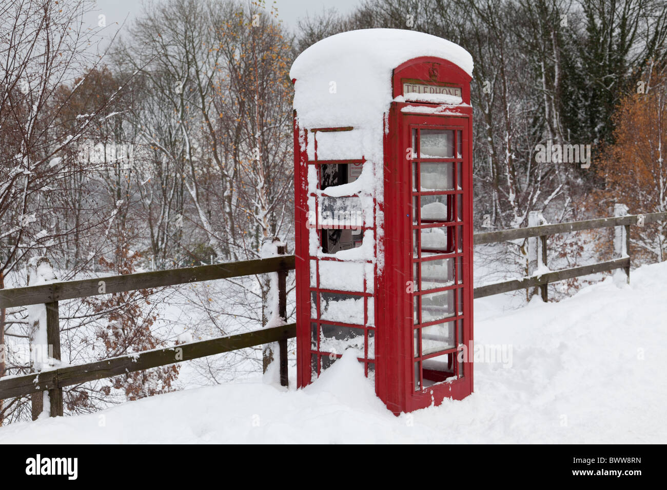 A traditional red telephone box designed by Sir Giles Gilbert Scott, is ...