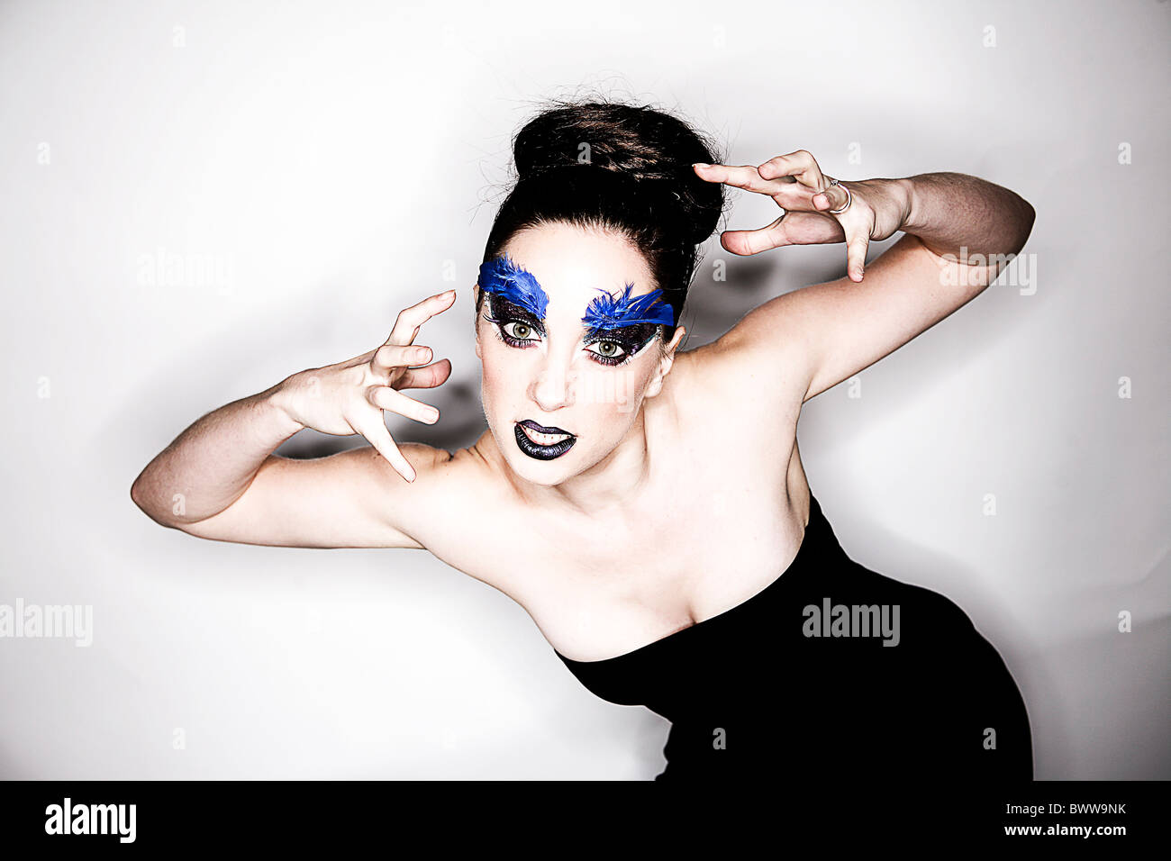 Portrait, extreme and aggressive, using angles. Extreme makeup and facial expressions. Fresh ...