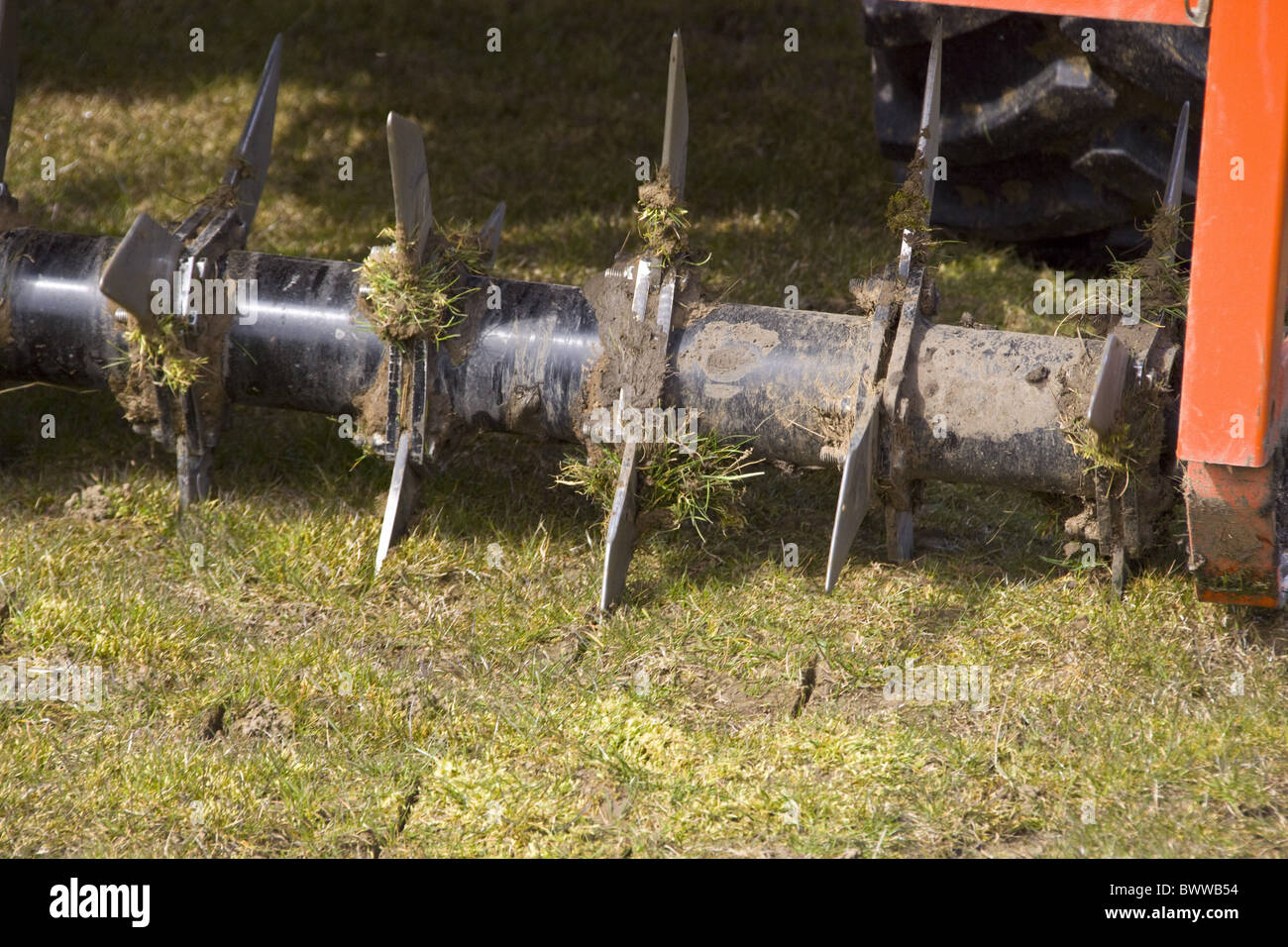 Aerating field using rotavater with blades slice Stock Photo - Alamy