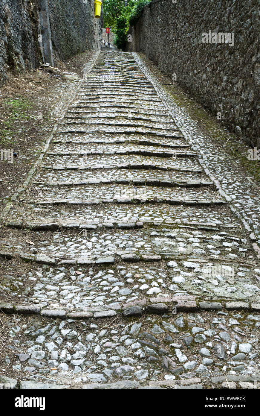 cobble stones and steps street in the historic centre of Spoleto in ...