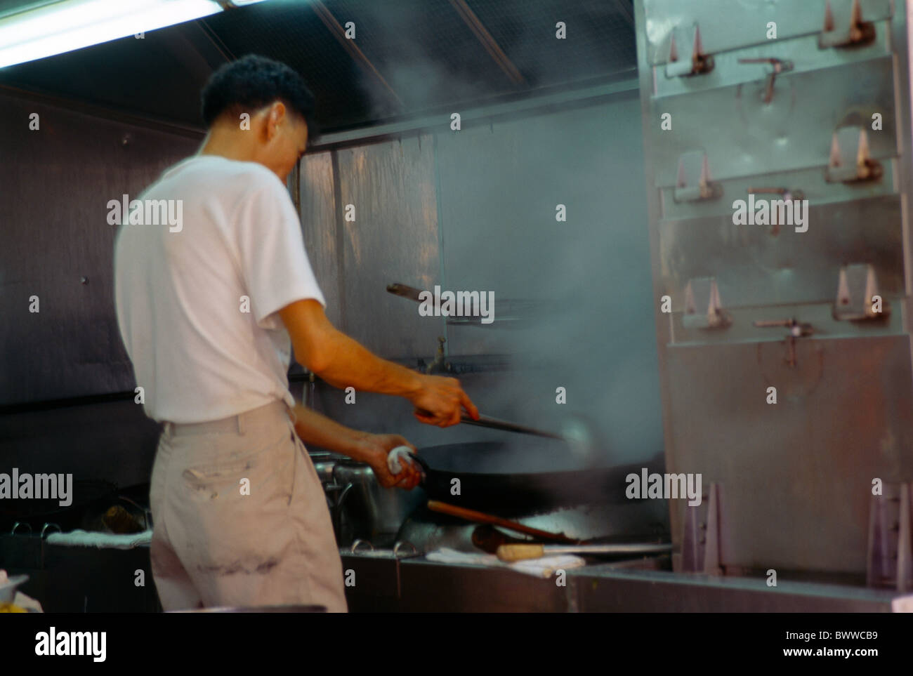 Chang Chou Hong Kong Man Cooking in a Wok Stock Photo - Alamy