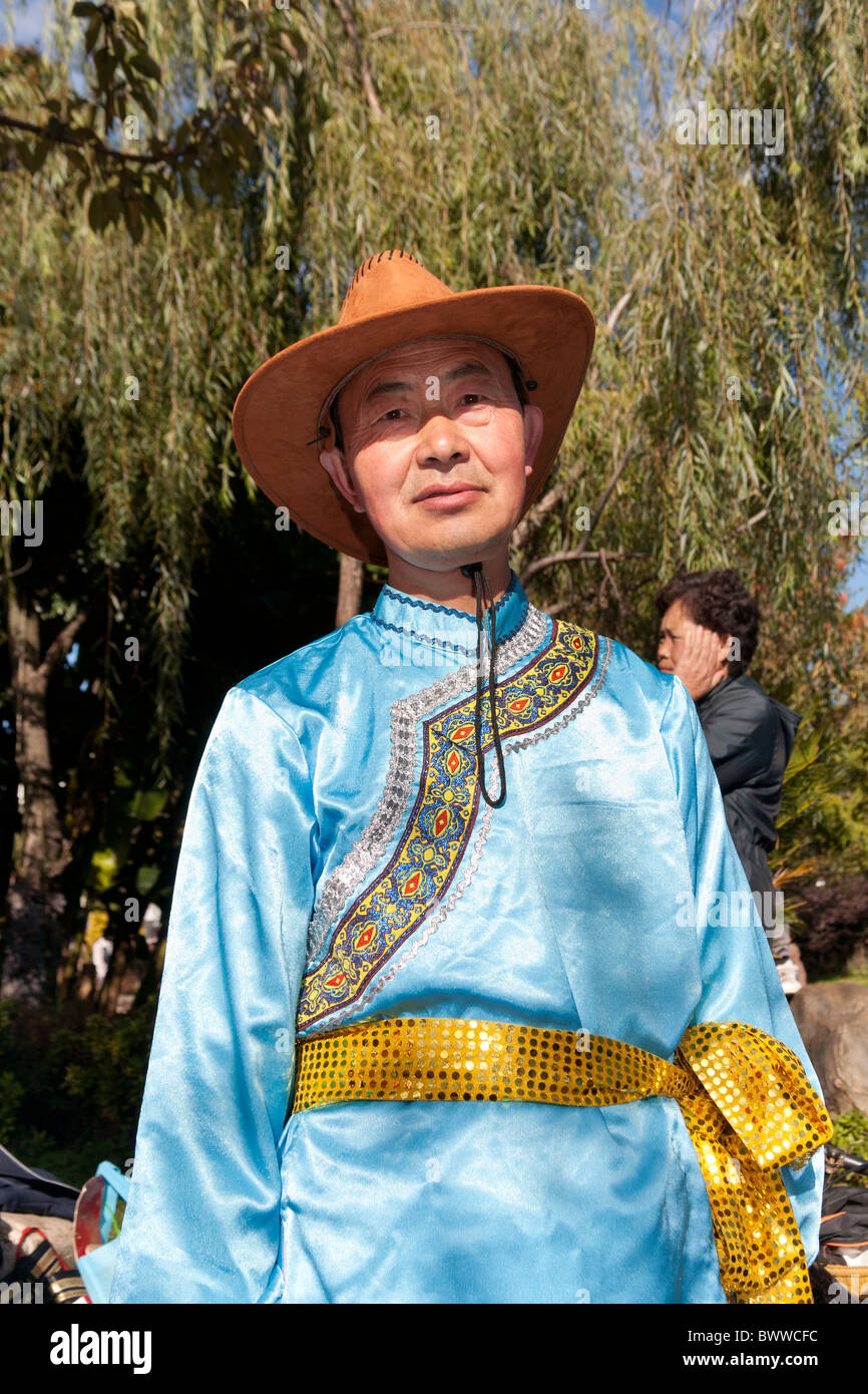 Man wearing a colourful Tibetan costume, Lijiang, Yunnan Province ...