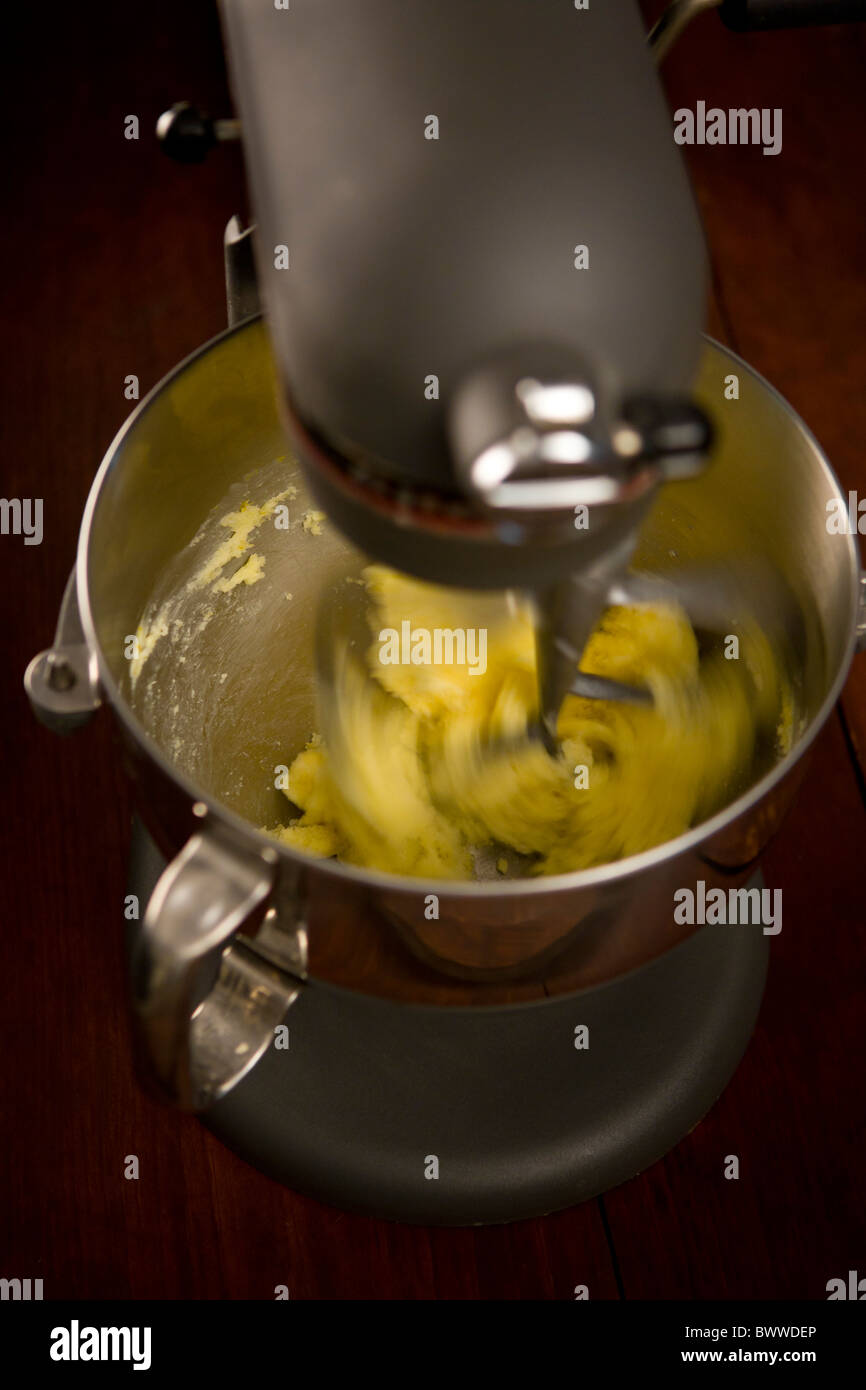Butter, sugar and orange zest mixing inside a stand mixer Stock Photo ...