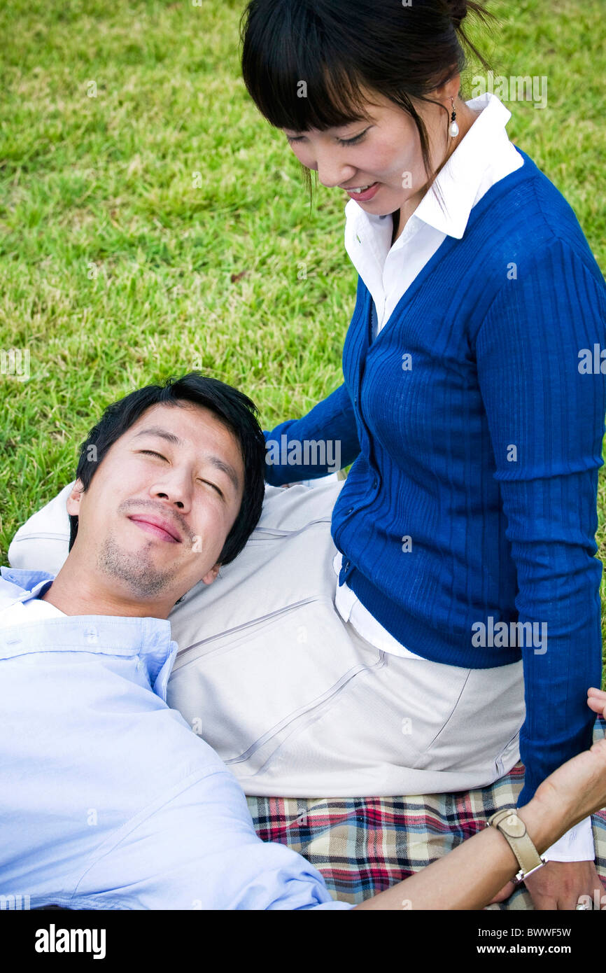 Man lying head on womans lap hi-res stock photography and images - Alamy