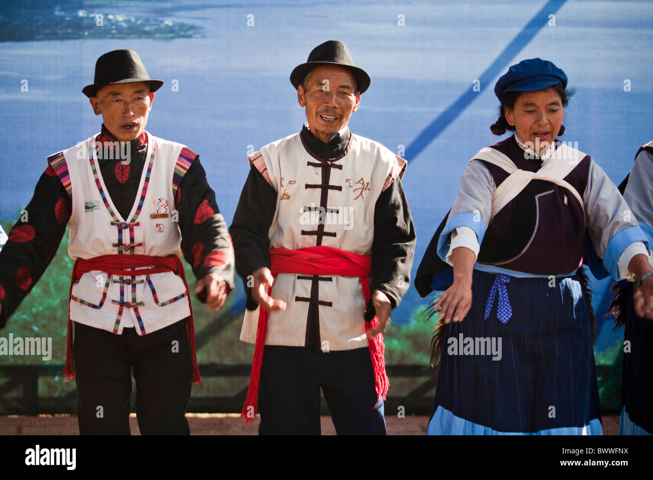 Naxi people dancing, wearing traditional costume, Lijiang, Yunnan ...