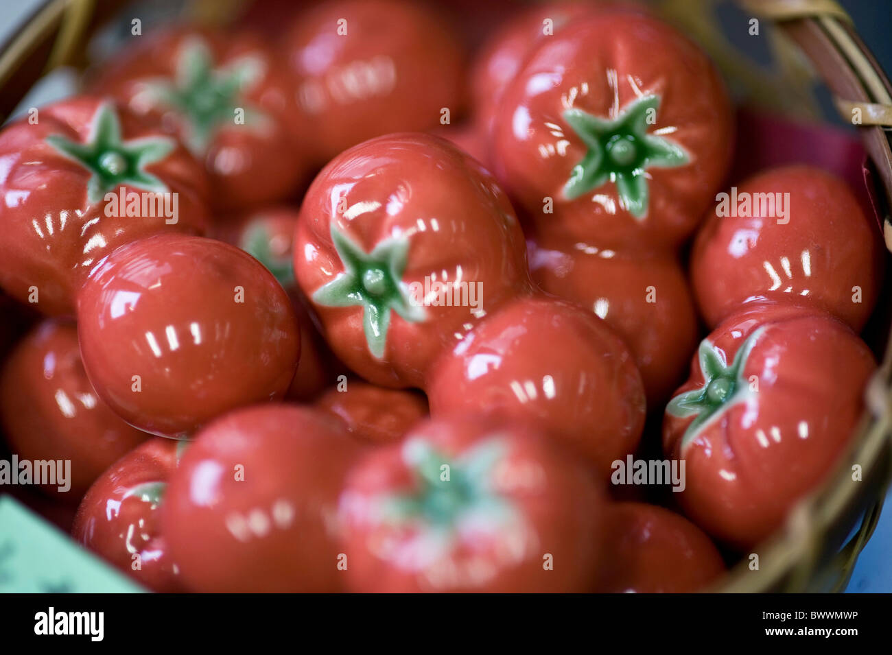 Pottery chop-stick rests in the shape of tomatoes are displayed at a ...