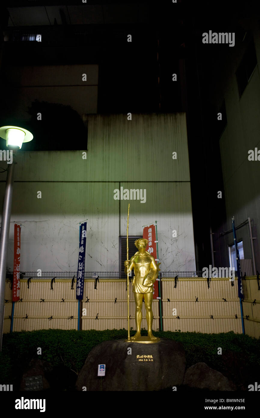 Photo shows a golden statue of the mythical Kappa creature, which has ...