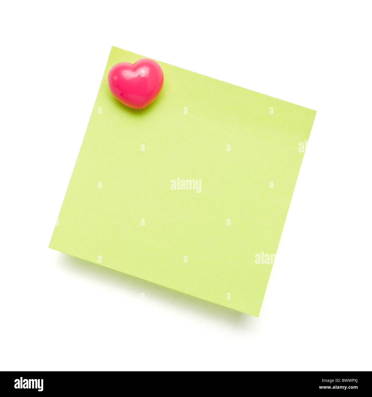 Green self adhesive post it note with heart shape push pin on white ...
