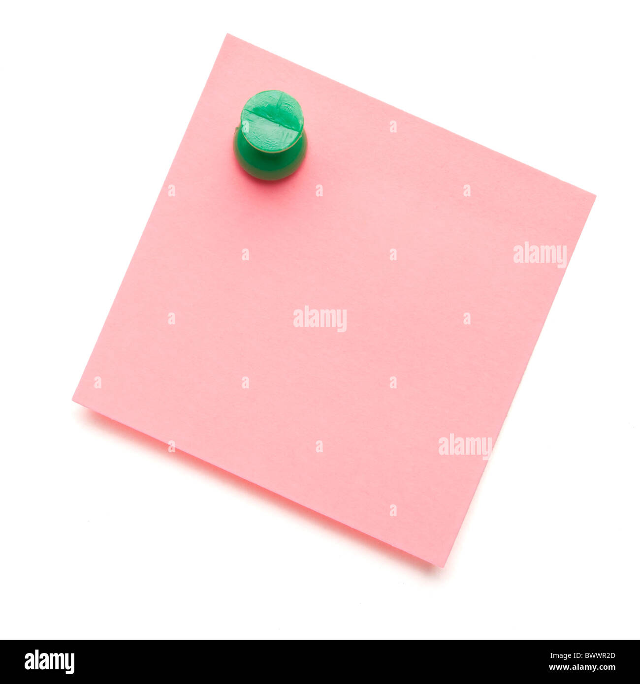 Light pink self adhesive post it note with green push pin on white ...