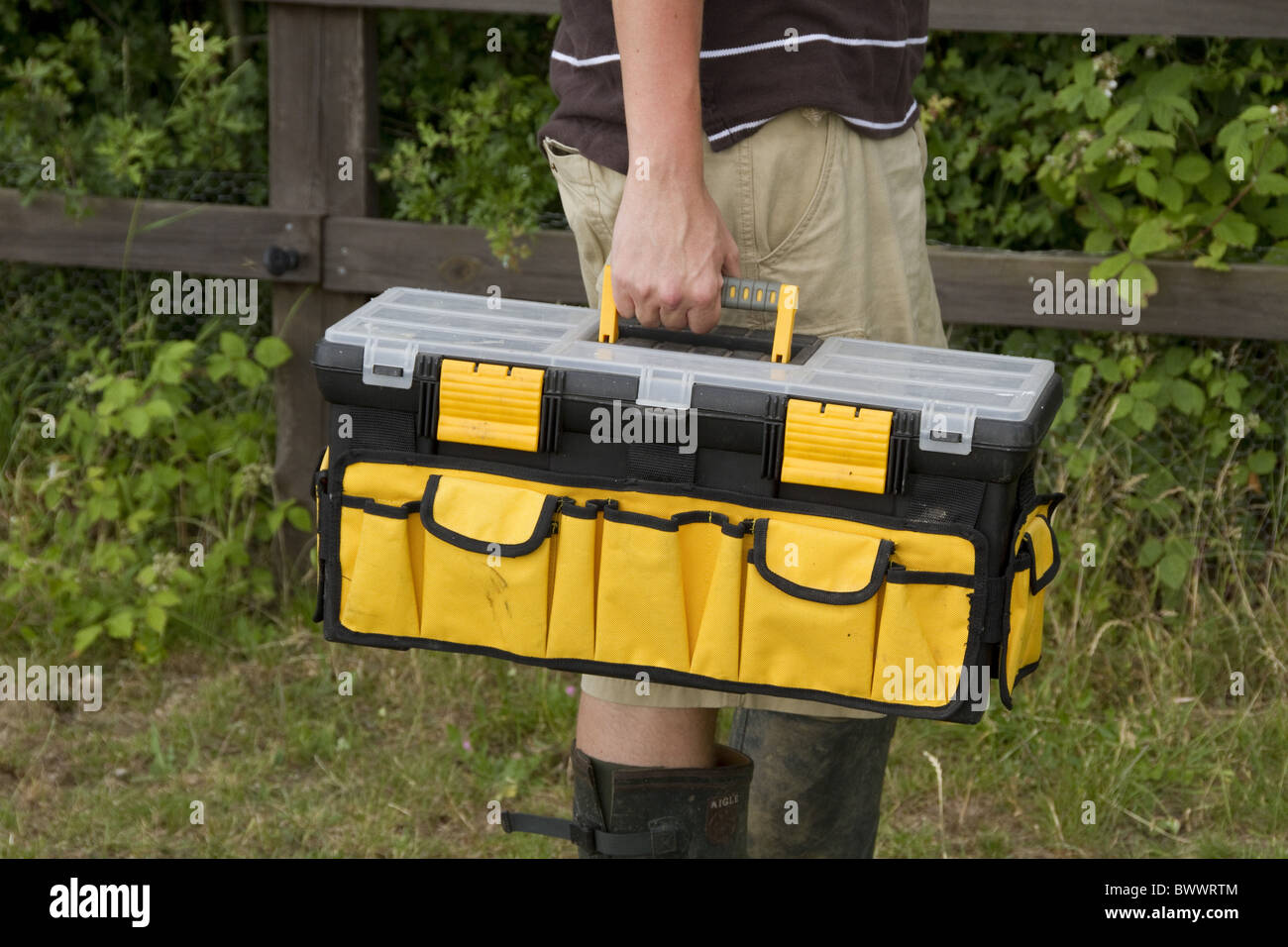 Carrying a tool box Stock Photo - Alamy
