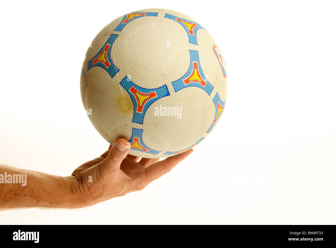 hand holding a football Stock Photo - Alamy