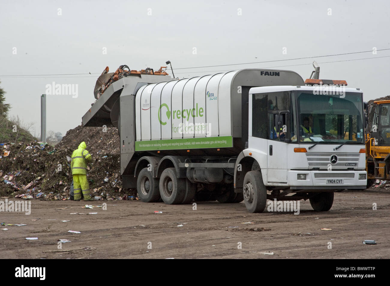 Recycling lorry unloading green waste hi-res stock photography and ...
