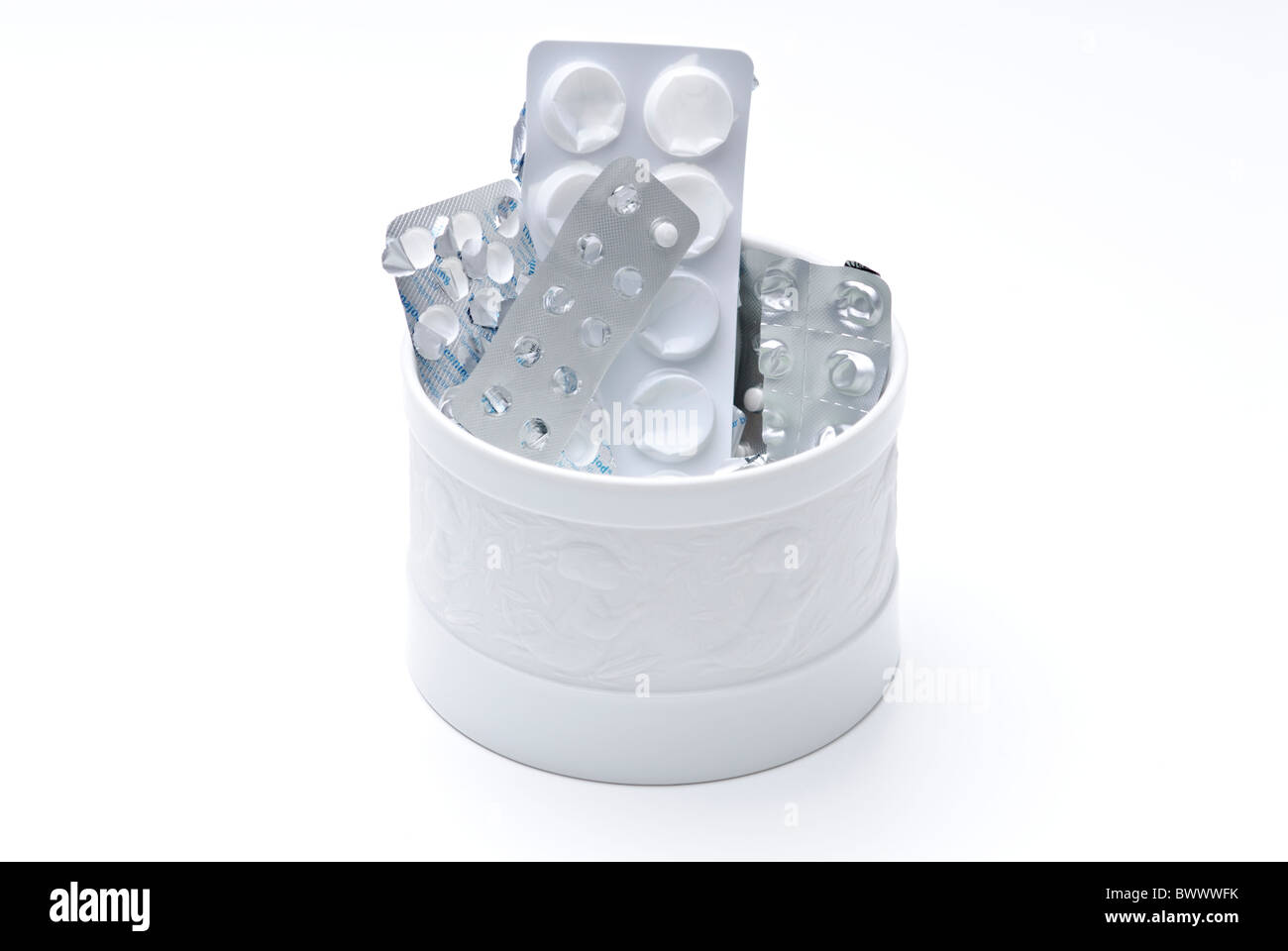 Porcelain pot with Pills in blister packs Stock Photo - Alamy