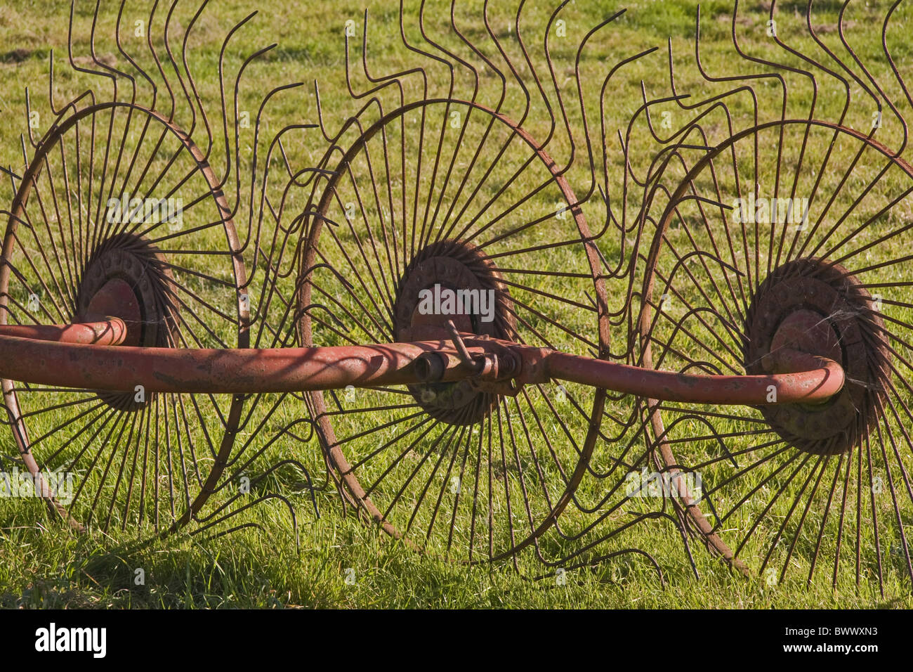 abstract close up tedder tedding haymaker turning wheeled wheels wire ...