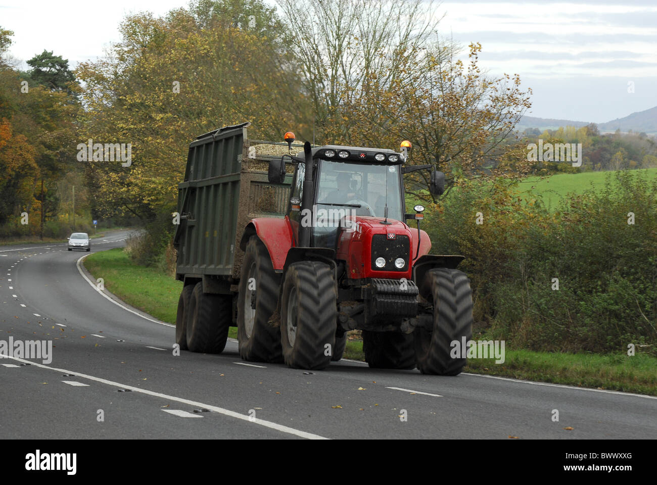 Massey Ferguson tractor carting trailer load Stock Photo - Alamy